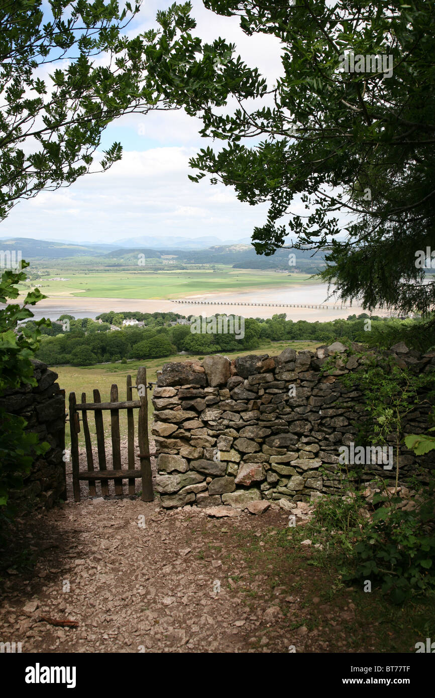 A wooden gate in a dry stone wall overlooking the railway viaduct ...