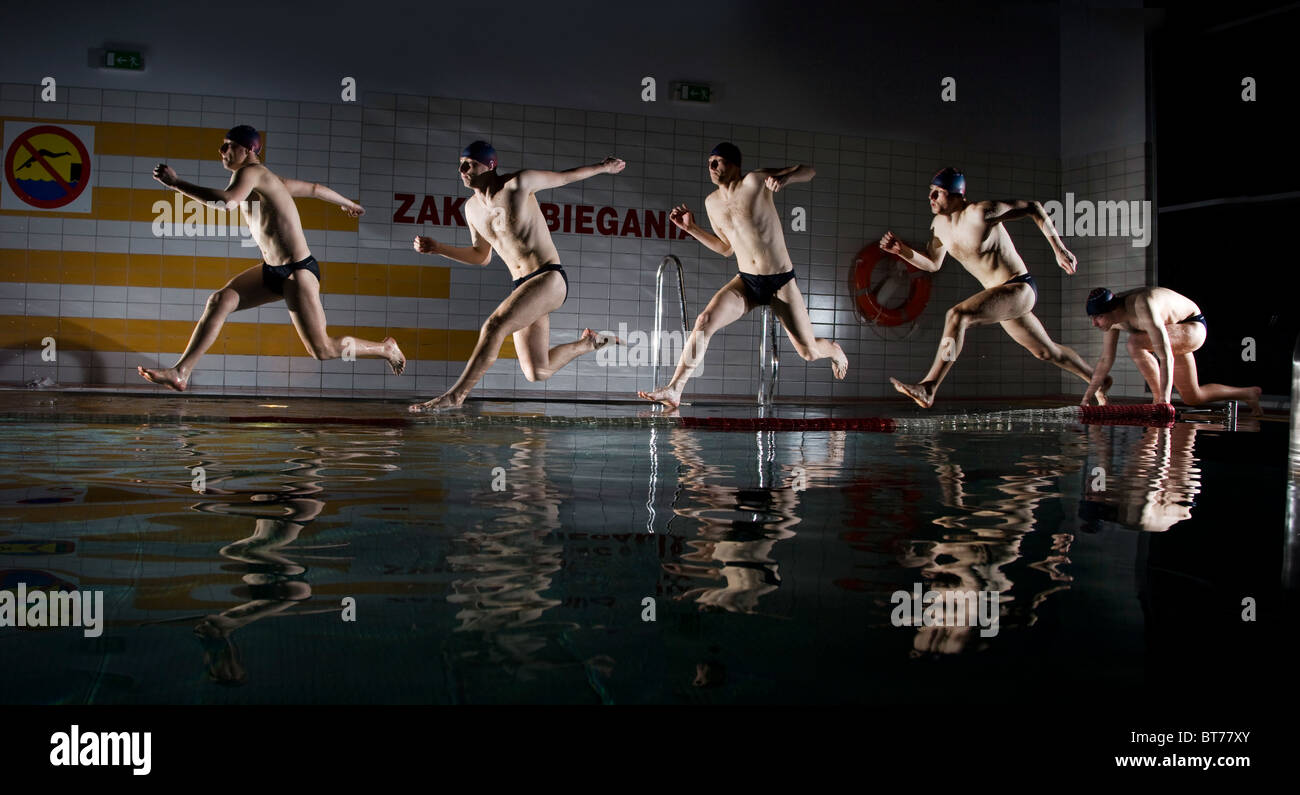 swimmer running on water on swimming pool Stock Photo - Alamy