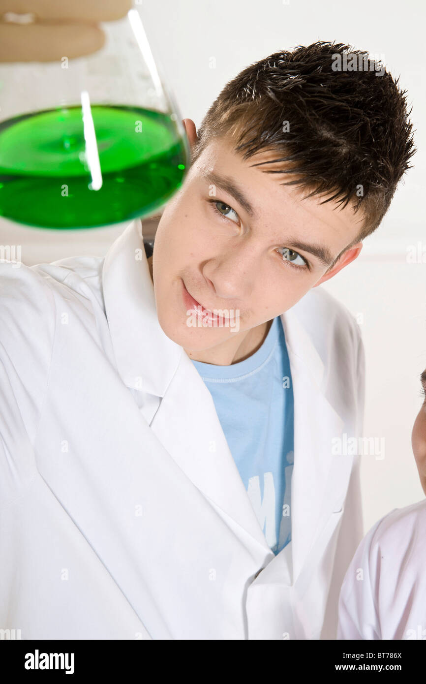 Teenage boy working in a laboratory Stock Photo - Alamy