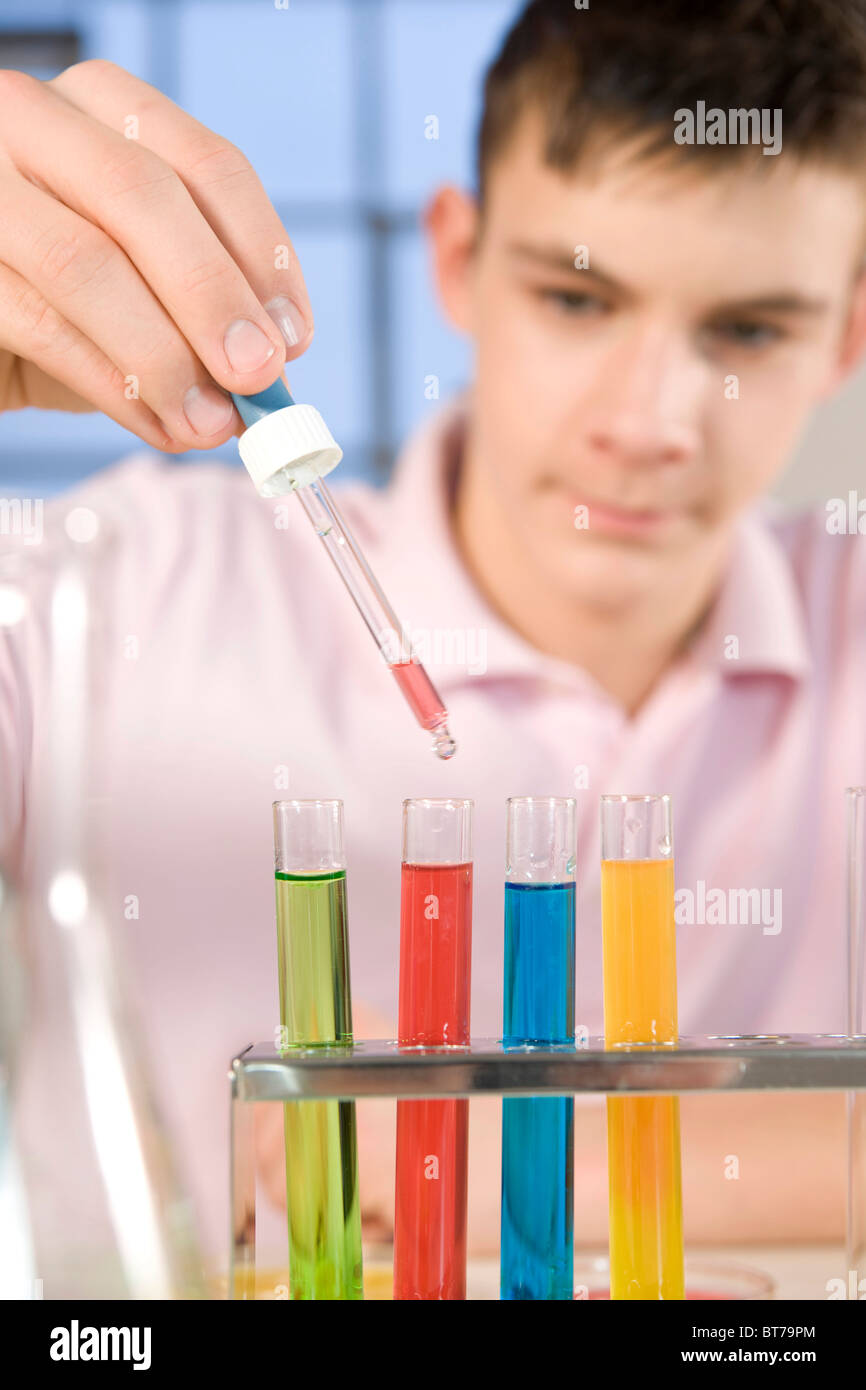 Teenage boy in a laboratory, working with test tubes Stock Photo - Alamy
