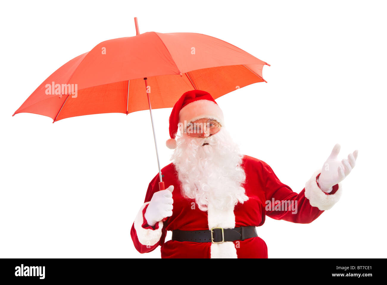 Photo of happy Santa Claus with red umbrella in isolation Stock Photo ...