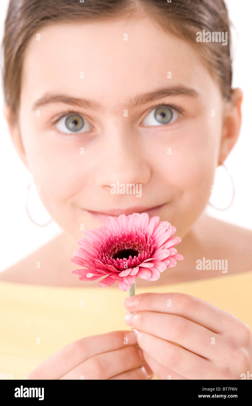 Girl smelling a flower Stock Photo - Alamy