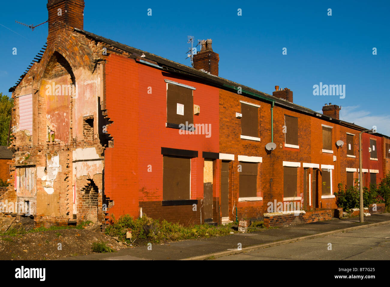 A row of derelict terraced housing awaiting demolition in the Clayton ...