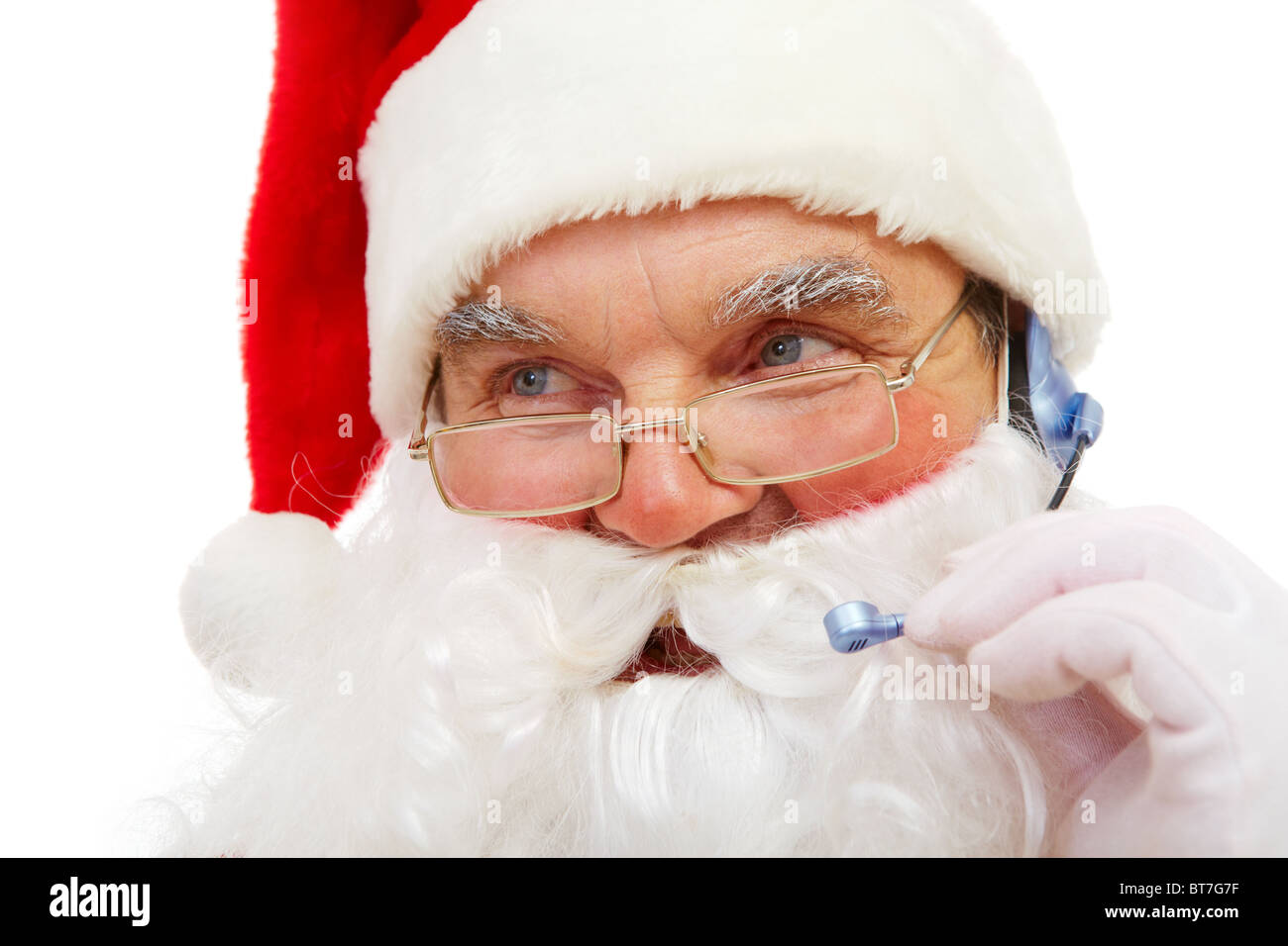 Photo of Santa Claus with headset talking to somebody Stock Photo - Alamy