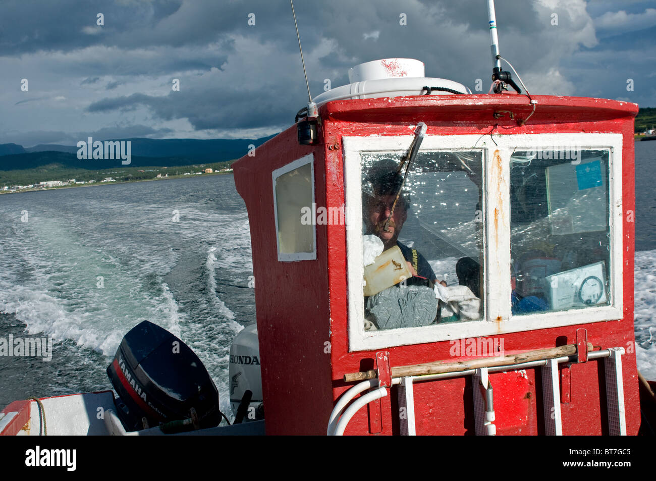 Cod Fisherman in wheel house Stock Photo - Alamy