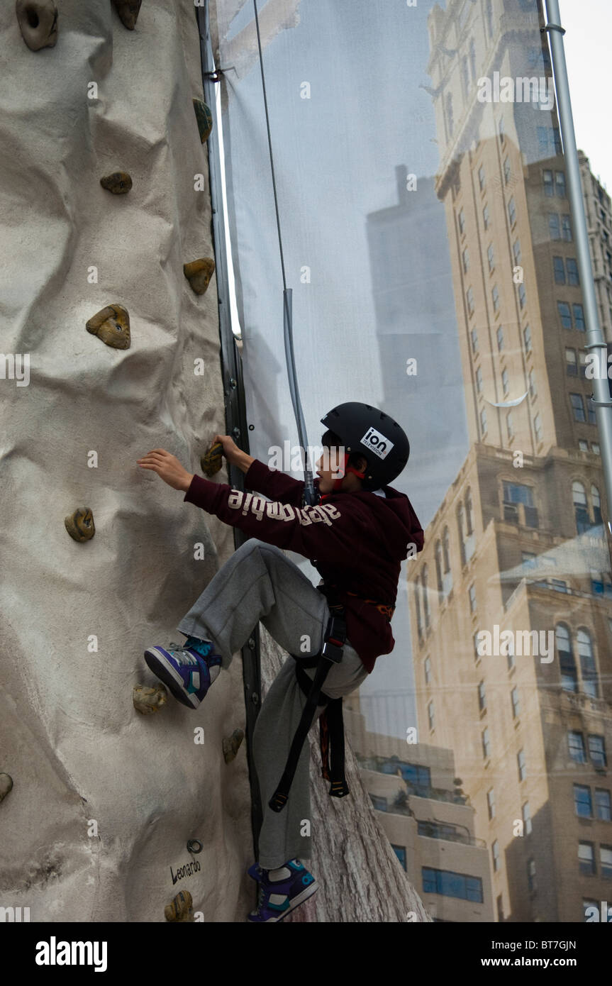 Students rock climb to raise money for their school's physical fitness ...