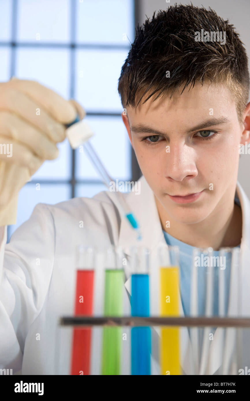 Teenage boy in a laboratory, working with test tubes Stock Photo - Alamy