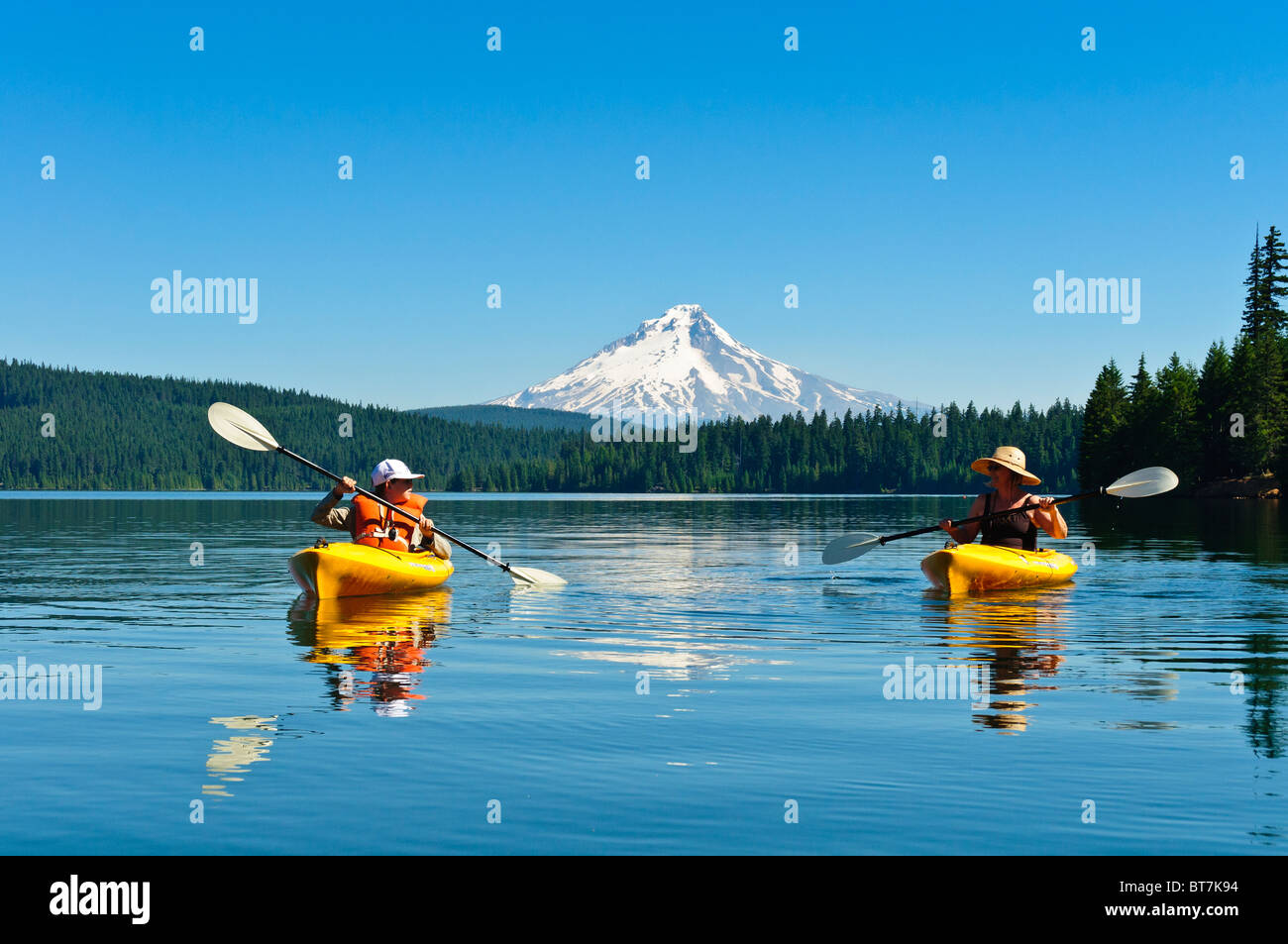 Woman and son kayaking at Timothy Lake, Mount Hood National Forest ...