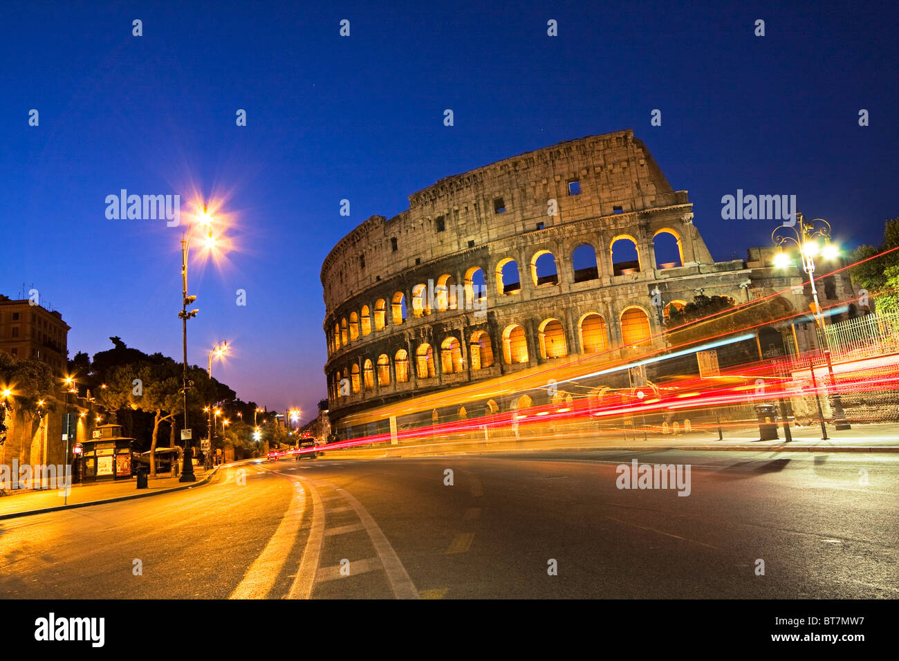 Colosseum at night with cars light trails, Rome Stock Photo - Alamy