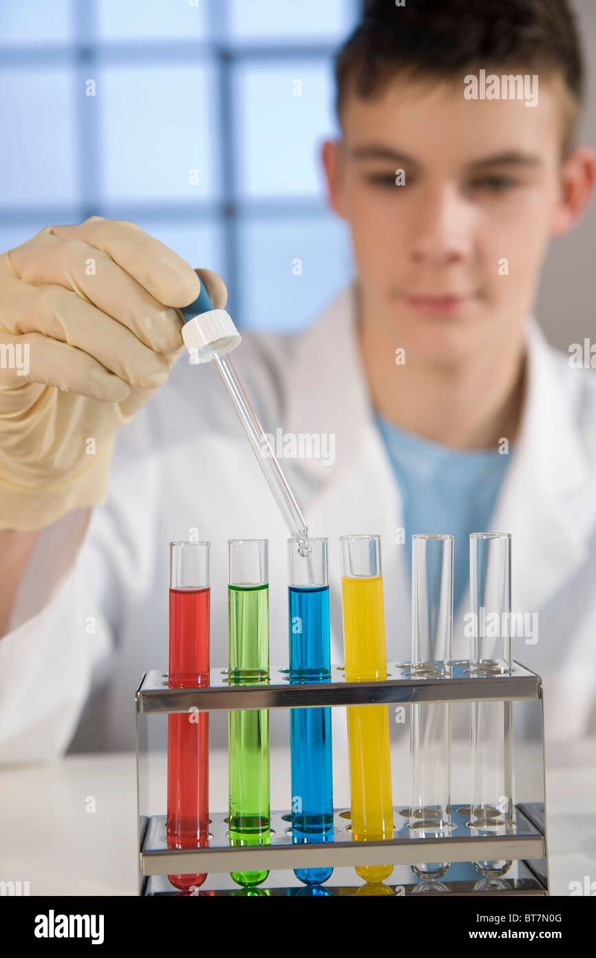 Teenage boy in a laboratory, working with test tubes Stock Photo - Alamy
