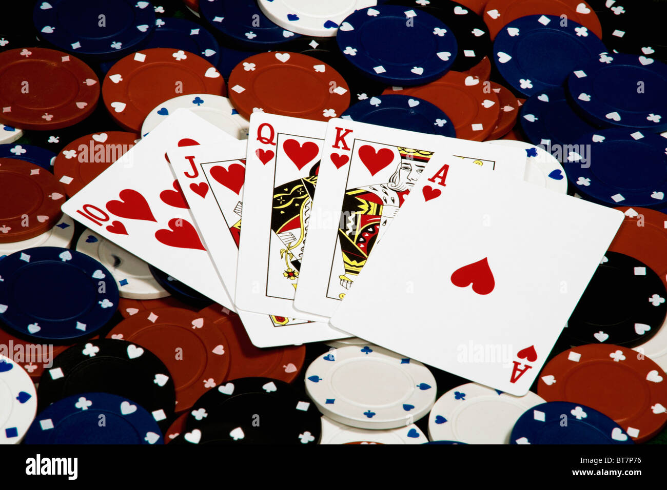 Playing cards, royal straight flush, poker chips Stock Photo - Alamy