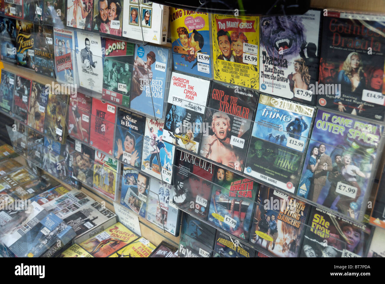 Various classic DVDs on display in a shop window Stock Photo - Alamy