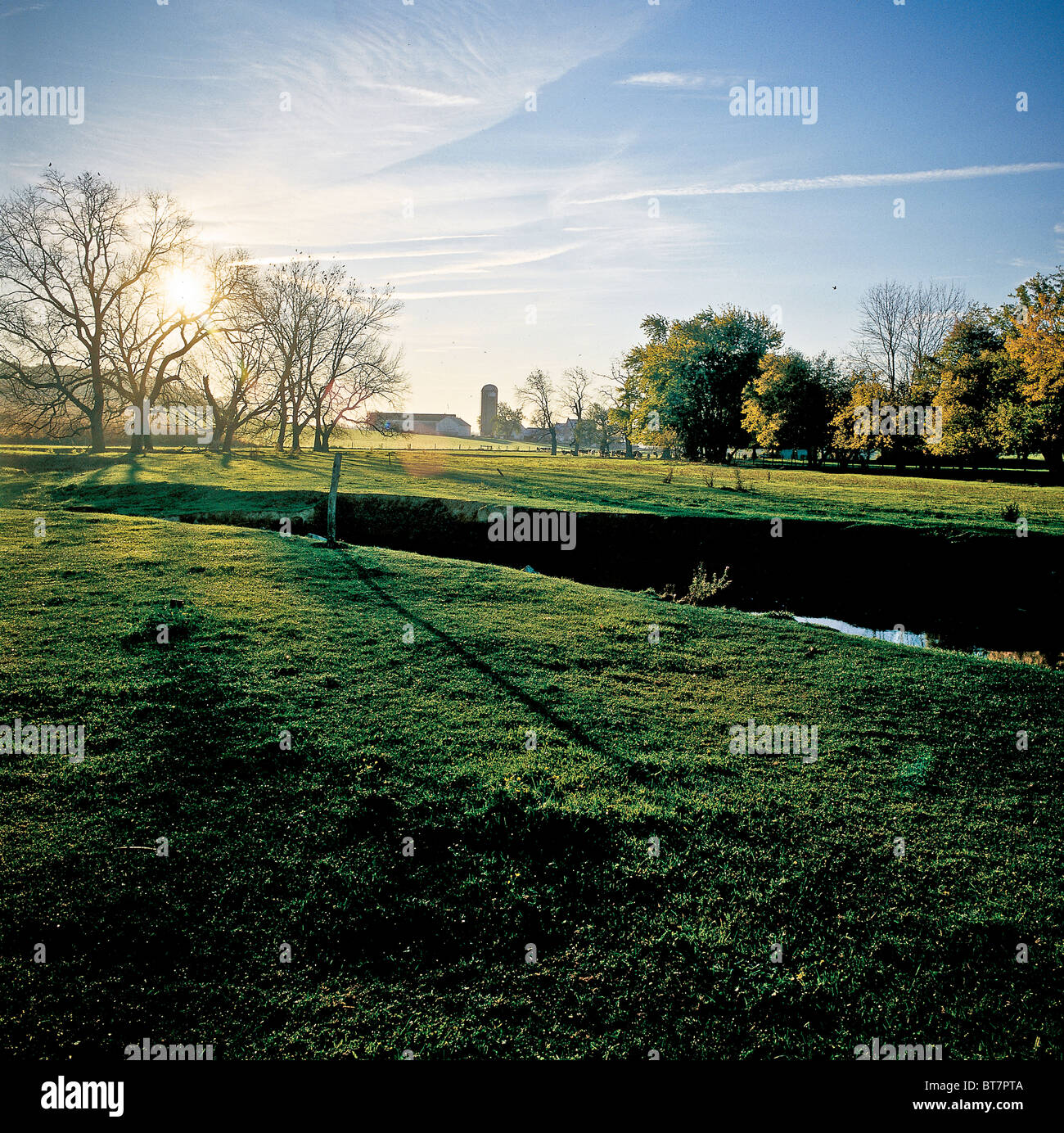 Early morning sunrise farm scene Stock Photo - Alamy