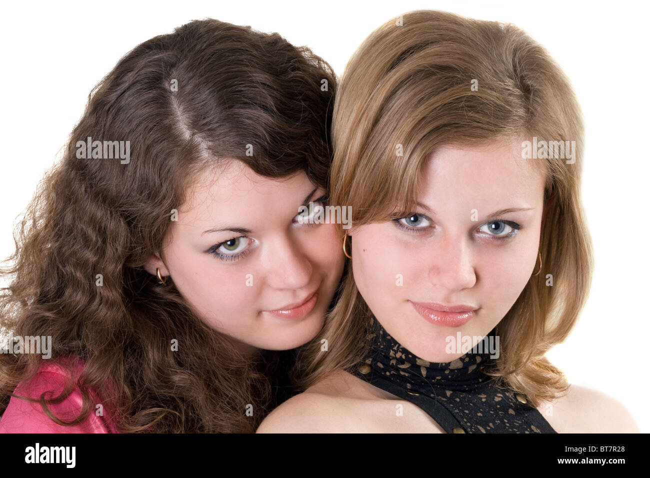 Portrait of the two beauty young women. Isolated Stock Photo - Alamy