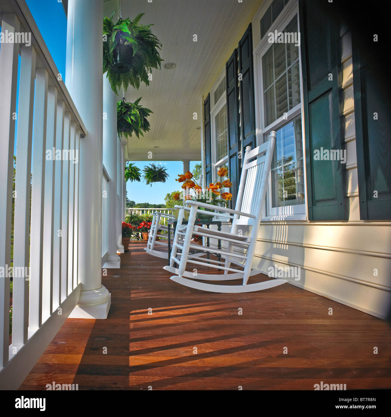 Relaxation area front porch residential house Stock Photo - Alamy