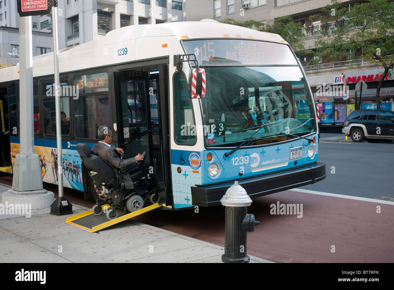 Commuters board a Select Bus Service bus on Second Avenue in Midtown in ...