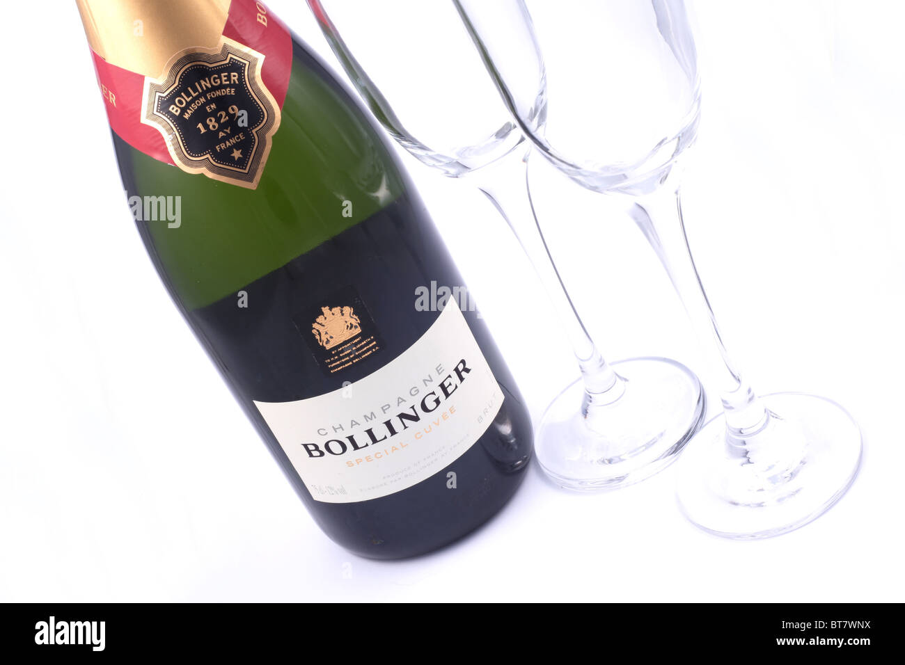 Bottle of Bollinger Special Cuvee Champagne with two champagne flutes ...