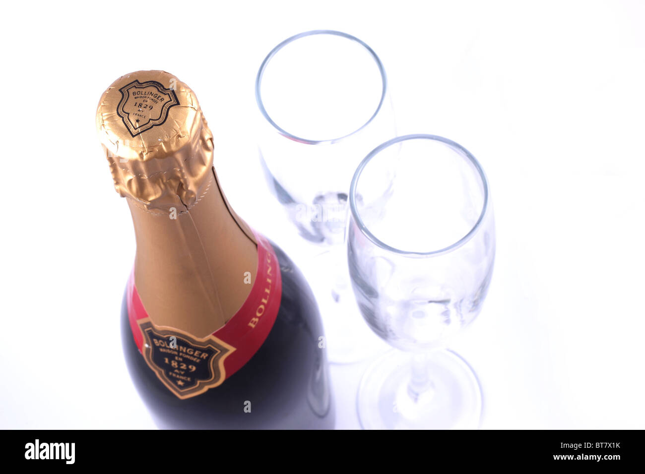 Bottle of Bollinger Special Cuvee Champagne with two champagne flutes ...