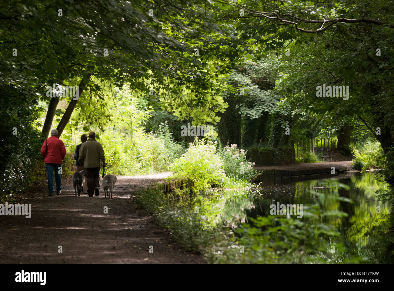 People walking alongside the Cromford Canal Stock Photo - Alamy