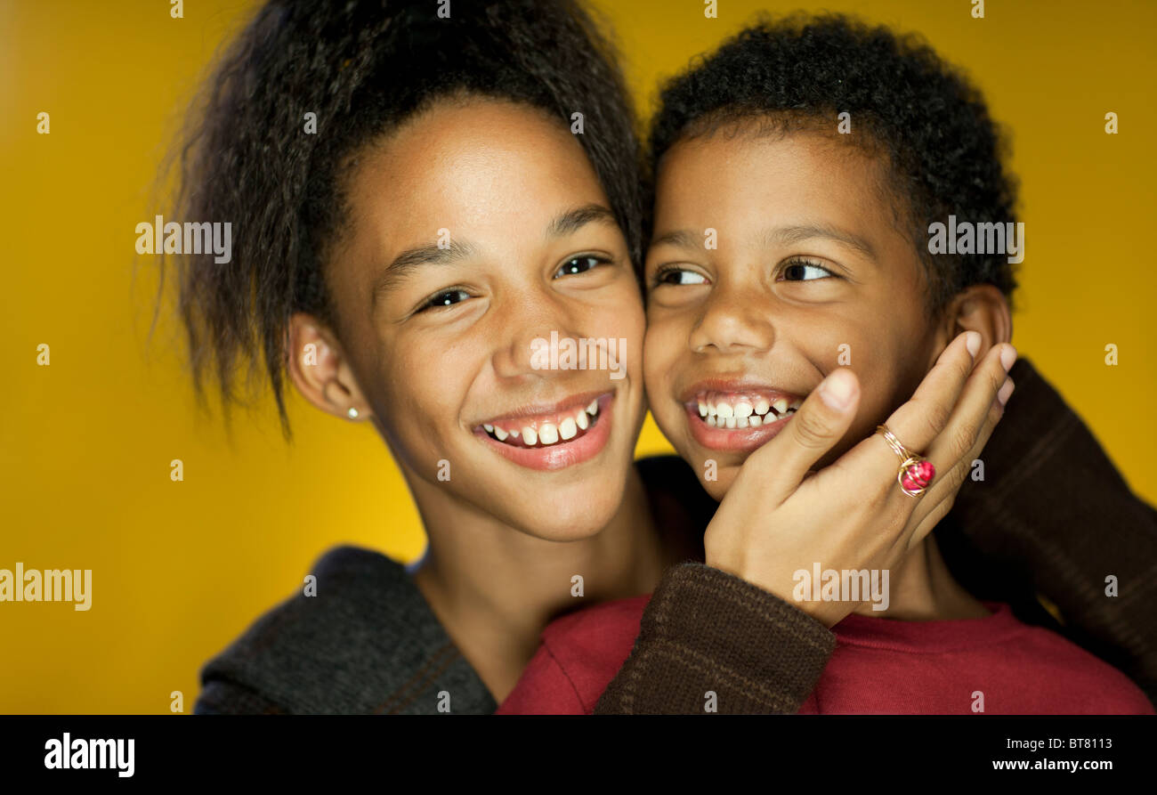 Portrait of a brother and sister smiling Stock Photo - Alamy