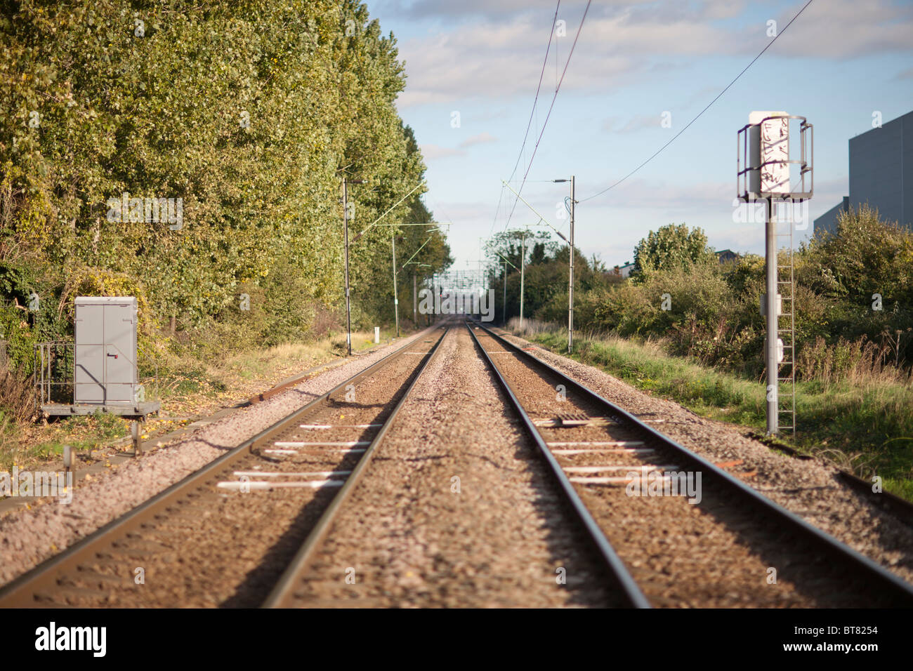 railway tracks,train lines in the distance,signals,sleepers,overhead ...