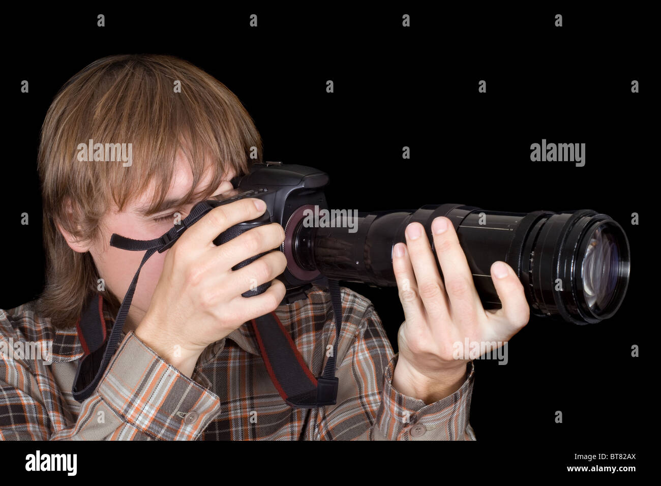Photographer with the camera with a zoom lens Stock Photo - Alamy