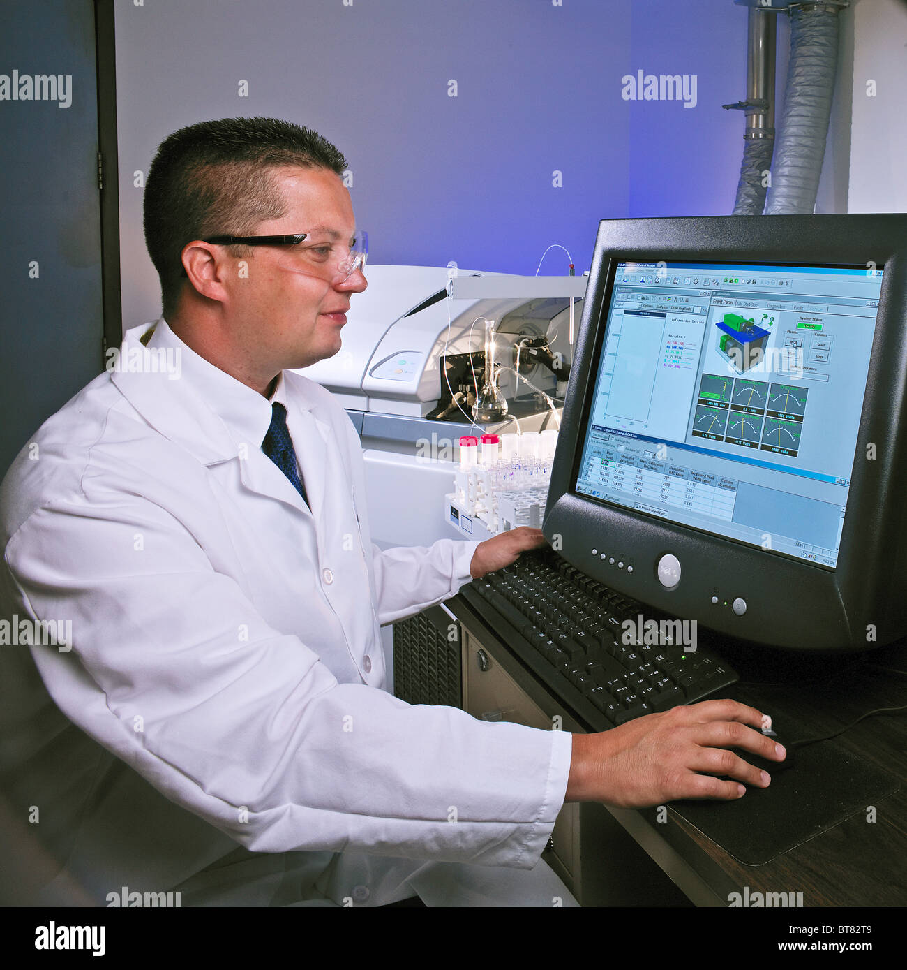 Scientific workers modern lab analysis equipment Stock Photo - Alamy