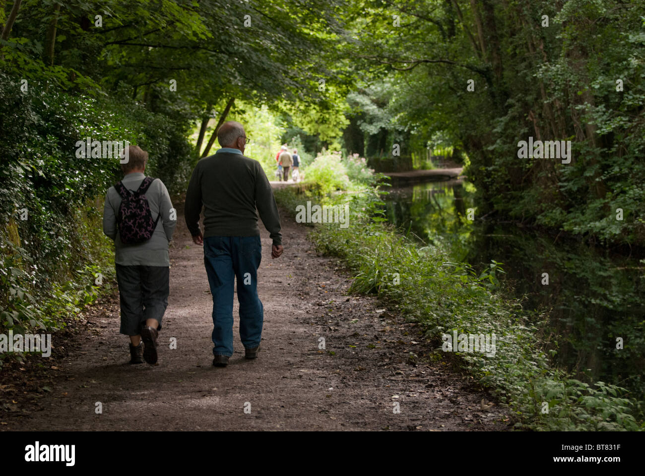 People walking alongside the Cromford Canal Stock Photo - Alamy