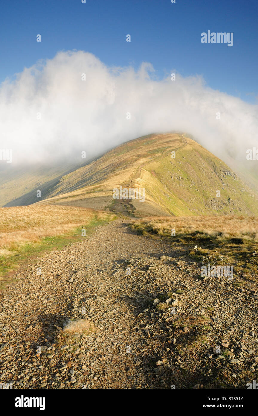 Mountain footpath approaching the cloudy summit of Fairfield in the ...