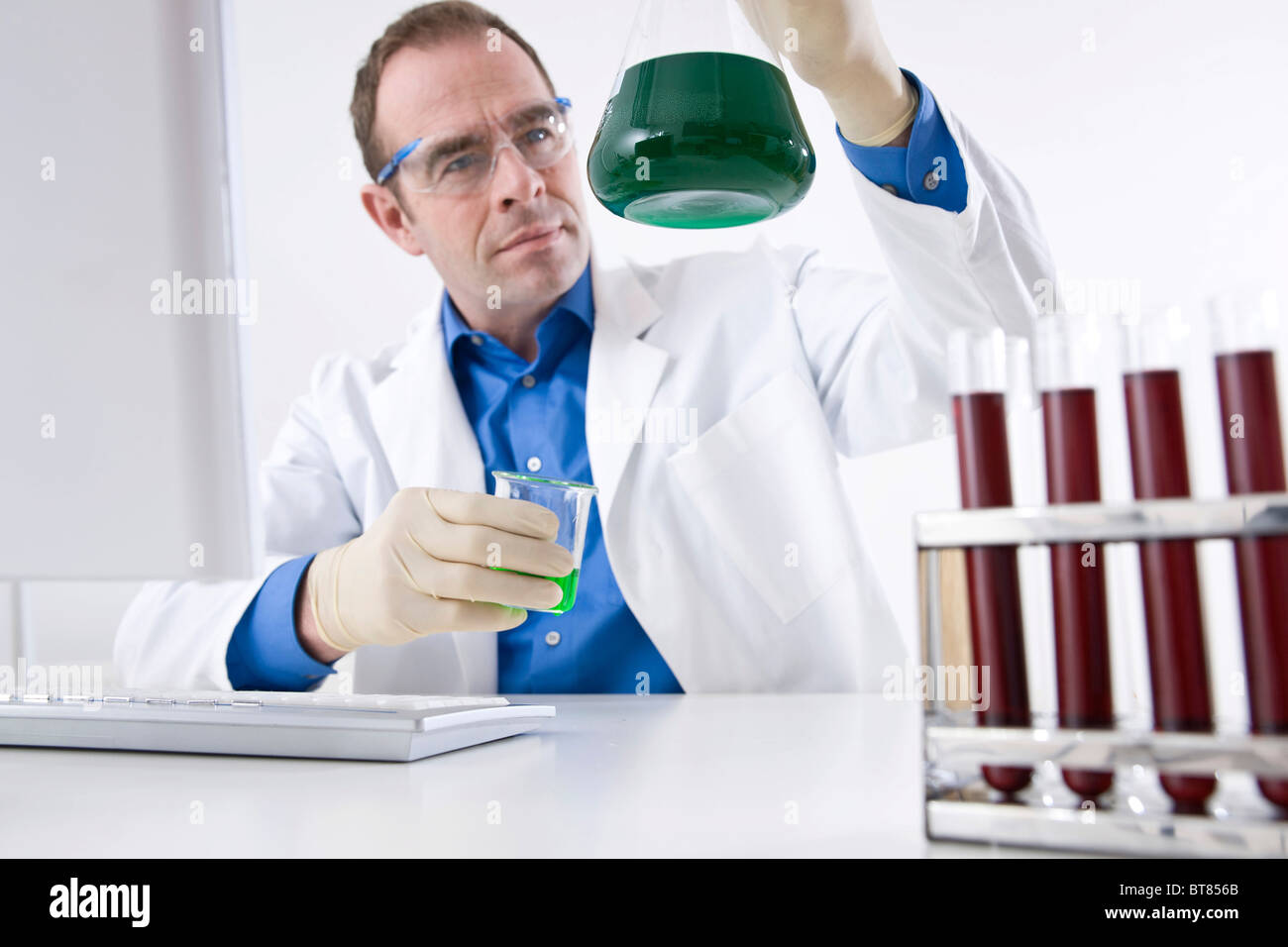 Man working on an experiment in a laboratory Stock Photo - Alamy