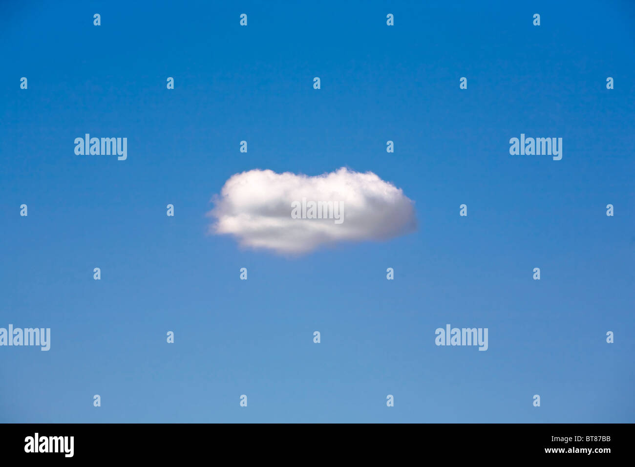 A single cloud floating in a blue sky Stock Photo - Alamy