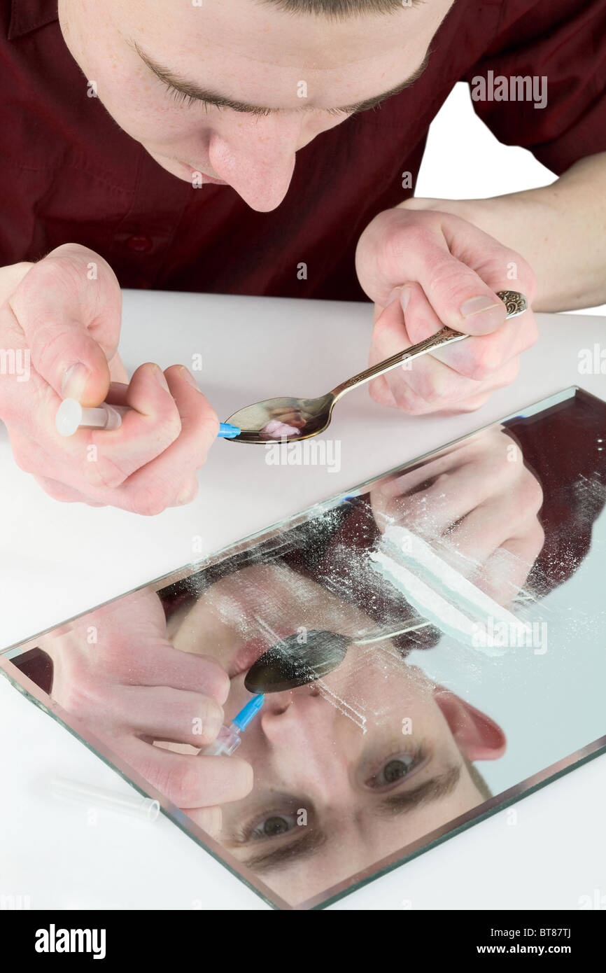 Guy make drug on the white background Stock Photo - Alamy