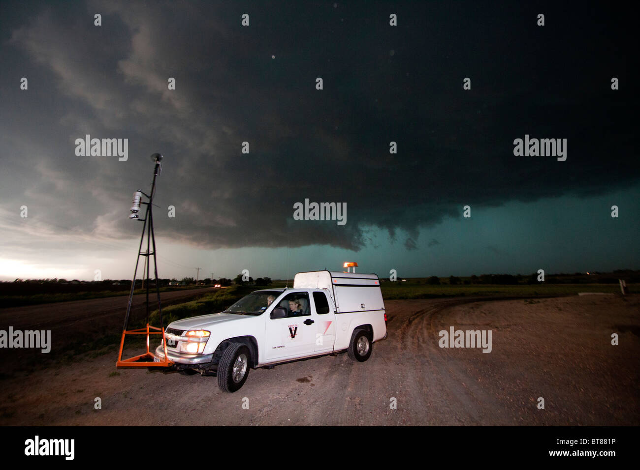 Storm chasers Tim Marshall and Carrie Wood-Cunningham perform a three ...