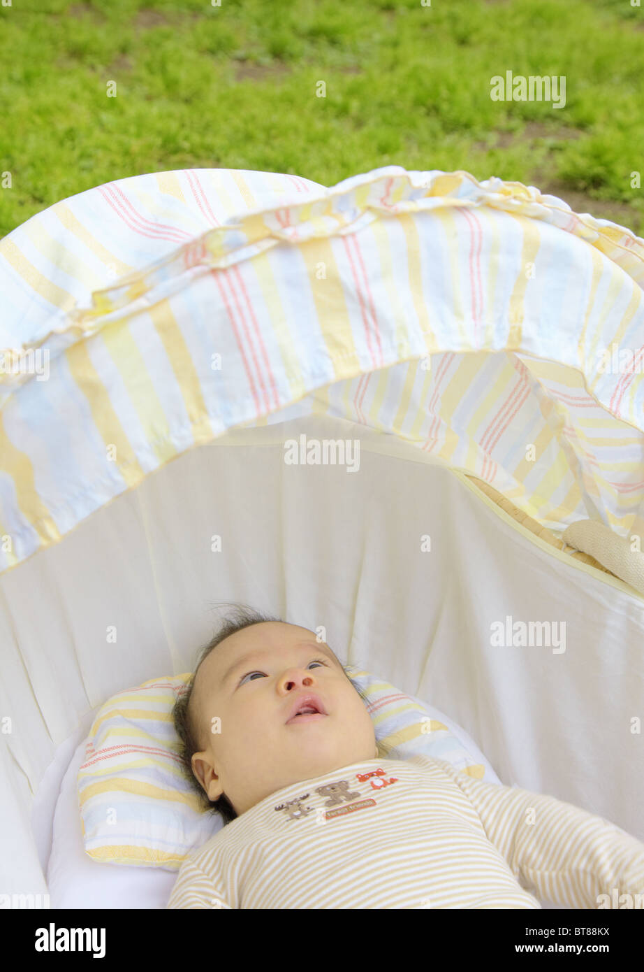 Baby in cradle Stock Photo - Alamy