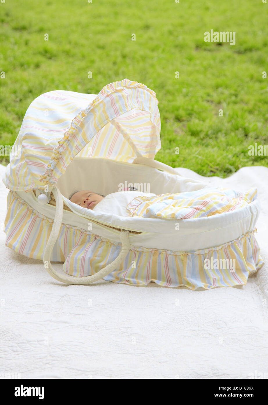 Baby in cradle Stock Photo - Alamy