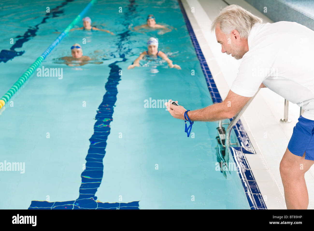 Female coach with swim team hi-res stock photography and images - Alamy