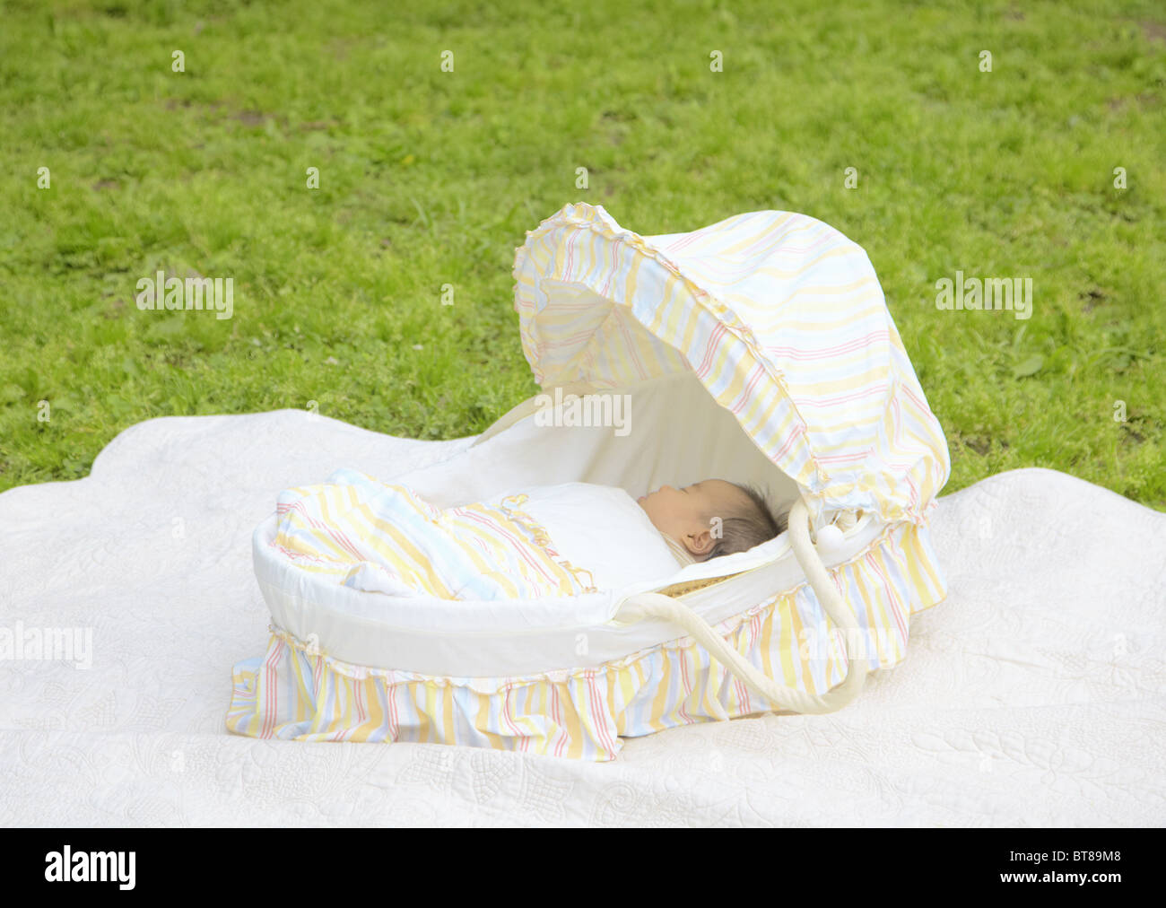 Baby in cradle Stock Photo - Alamy