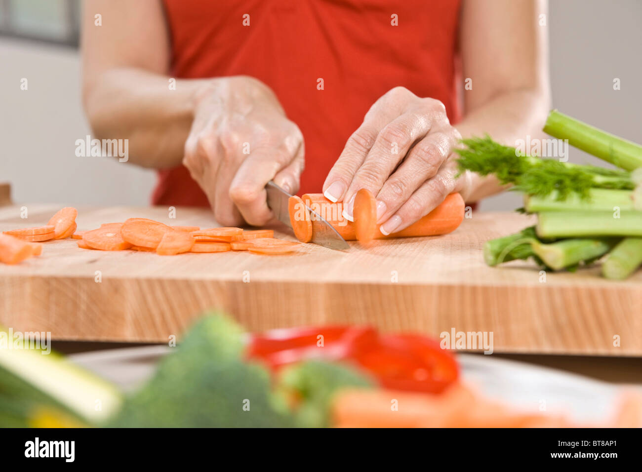 Section of a woman, cutting vegetables Stock Photo - Alamy