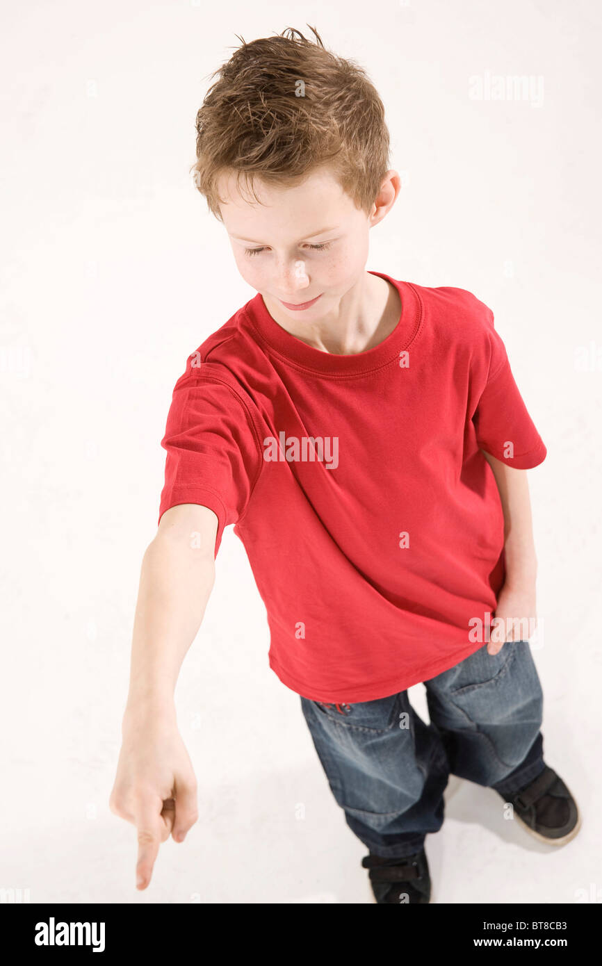 Boy pointing into a certain direction with his index finger Stock Photo ...