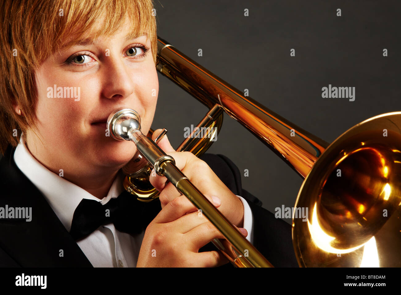 Woman playing trombone hi-res stock photography and images - Alamy