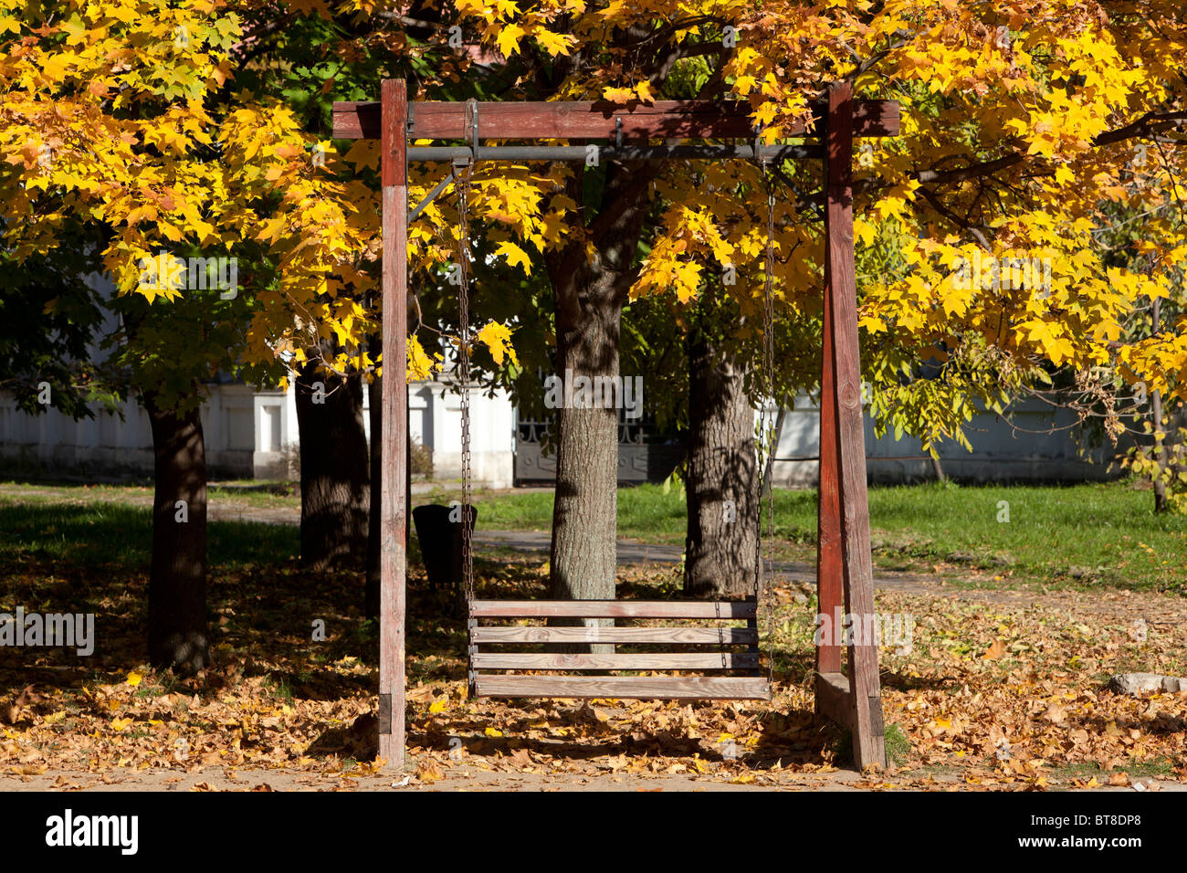 A wooden swing at the Fallen Monument Park (Muzeon Park of Arts) in ...