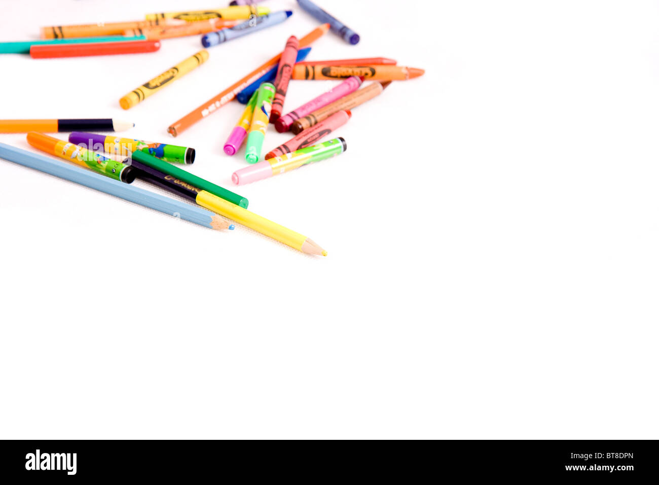 Scattered felt-tip pens and pencils on a white background Stock Photo ...