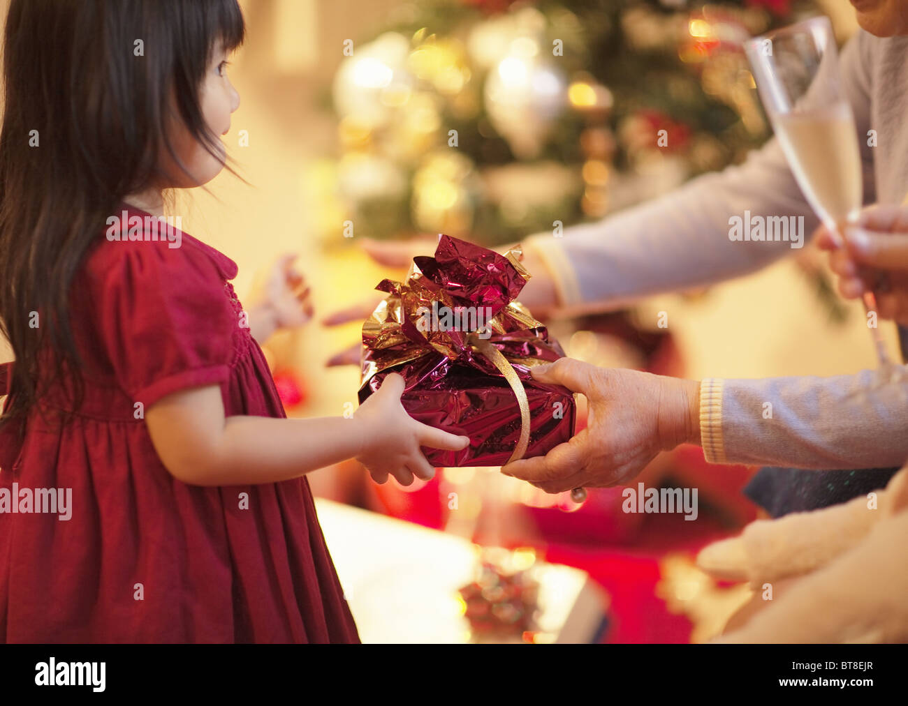 Girl receiving a gift Stock Photo - Alamy