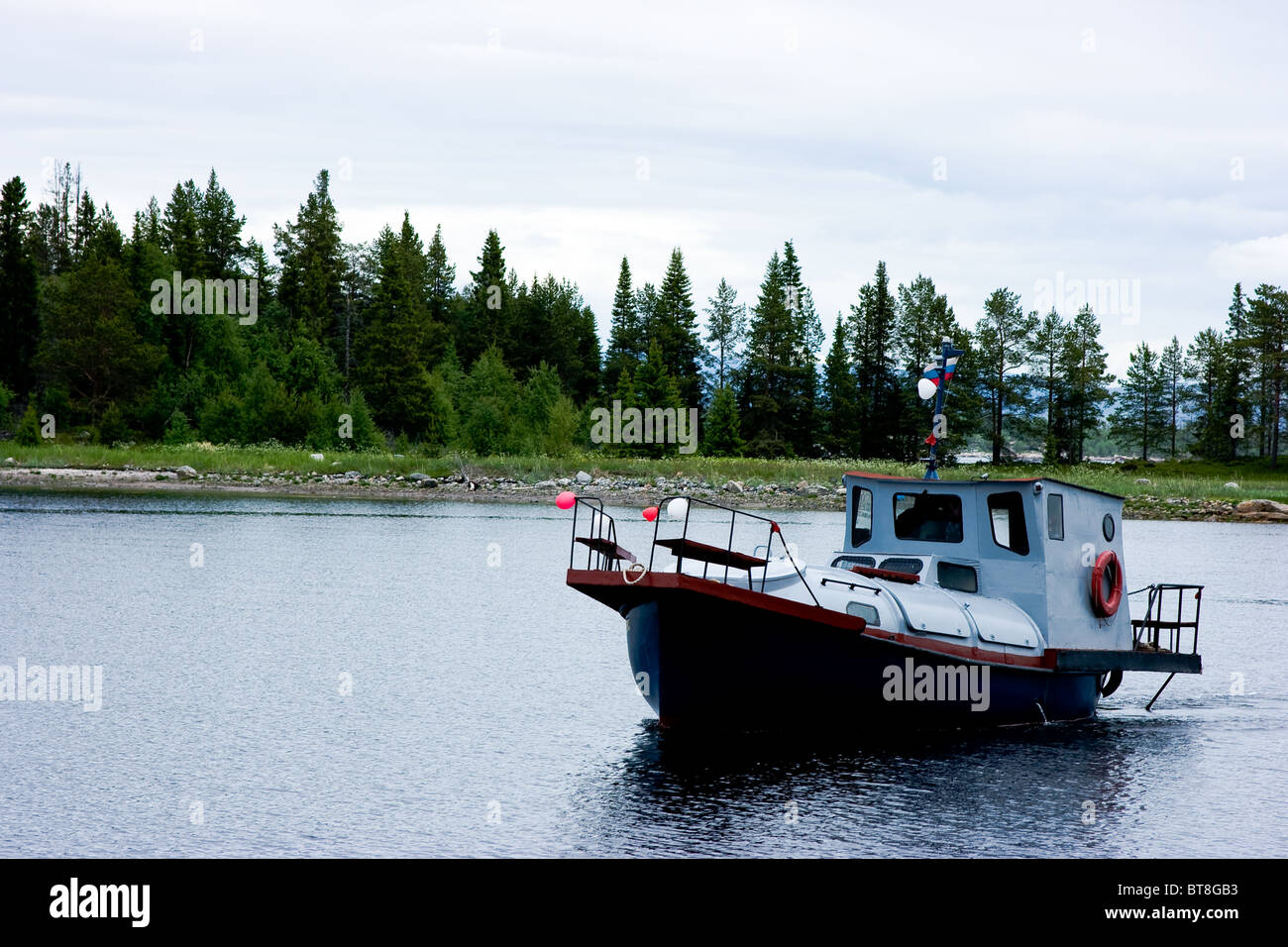 Drifting boat on a gulf Stock Photo - Alamy