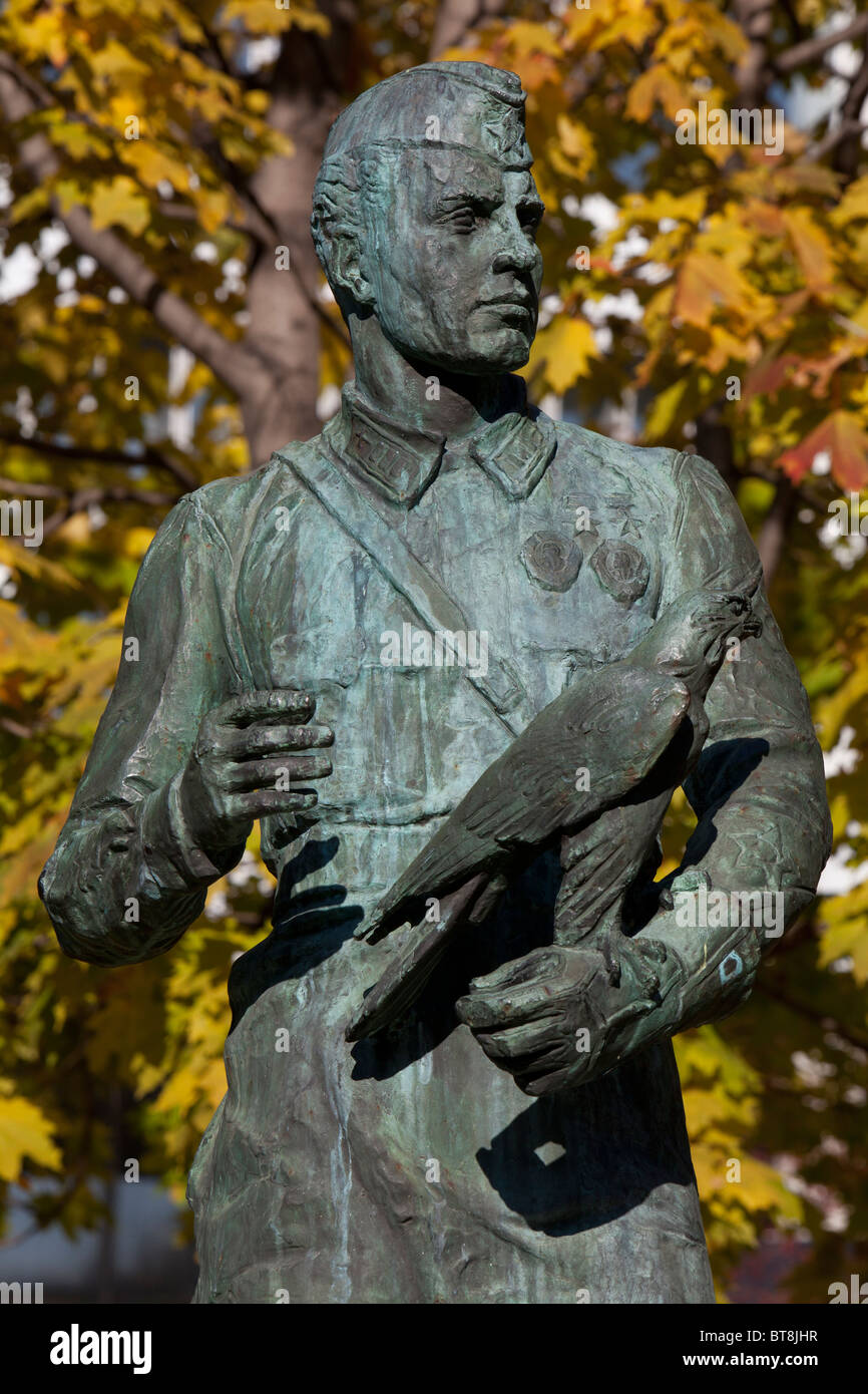 Statue of a Red Army soldier holding a falcon at the Fallen Monument ...
