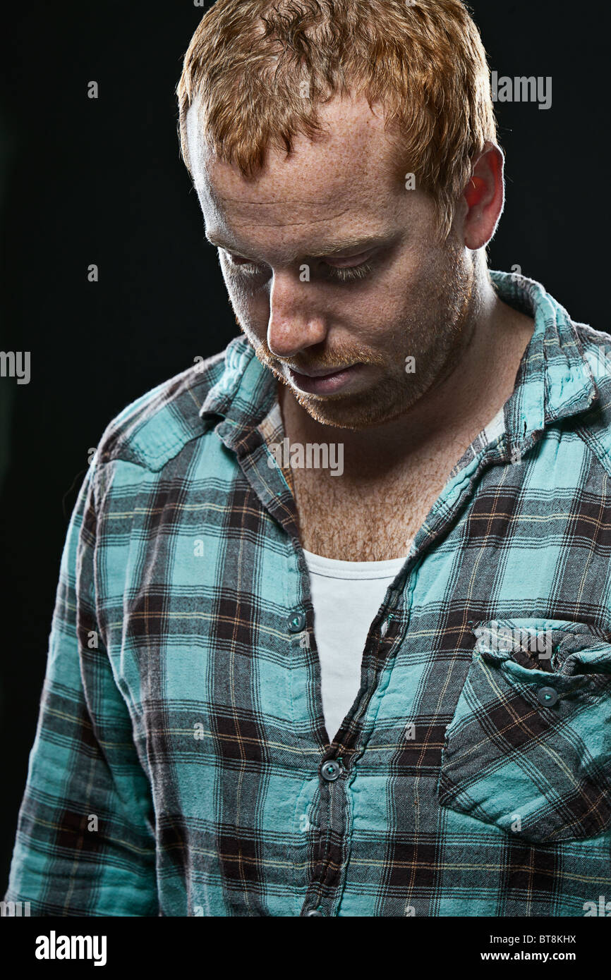 Shot of a Red Headed Male Looking Down Stock Photo - Alamy