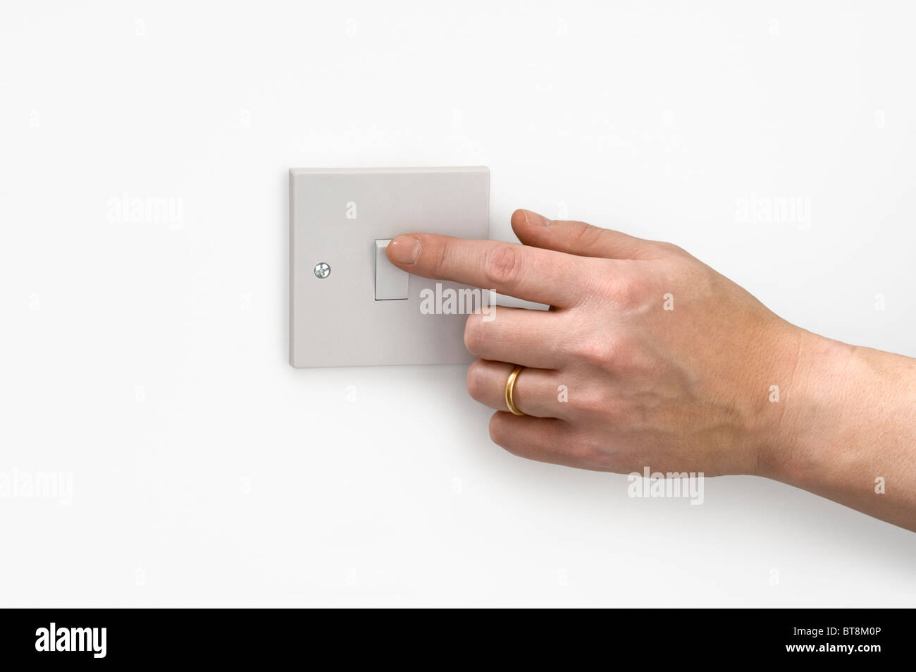 A hand operating a light switch Stock Photo - Alamy