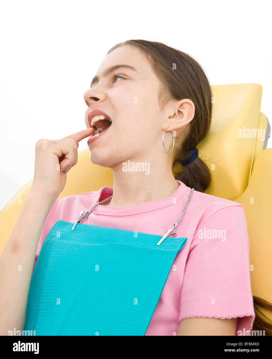 Girl with a toothache, on a treatment chair Stock Photo - Alamy