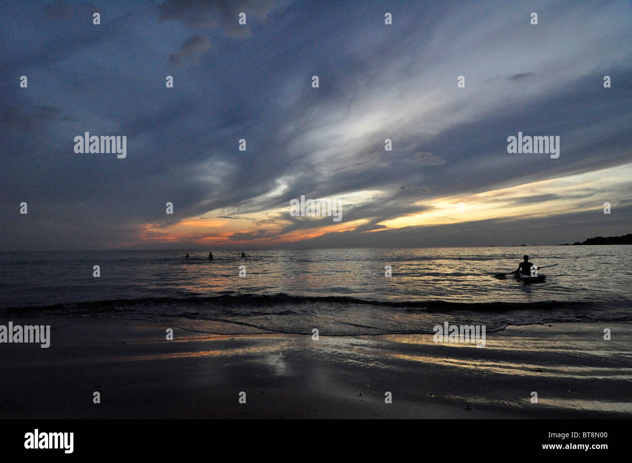 Man canoeing at sunset, Goa, India Stock Photo - Alamy