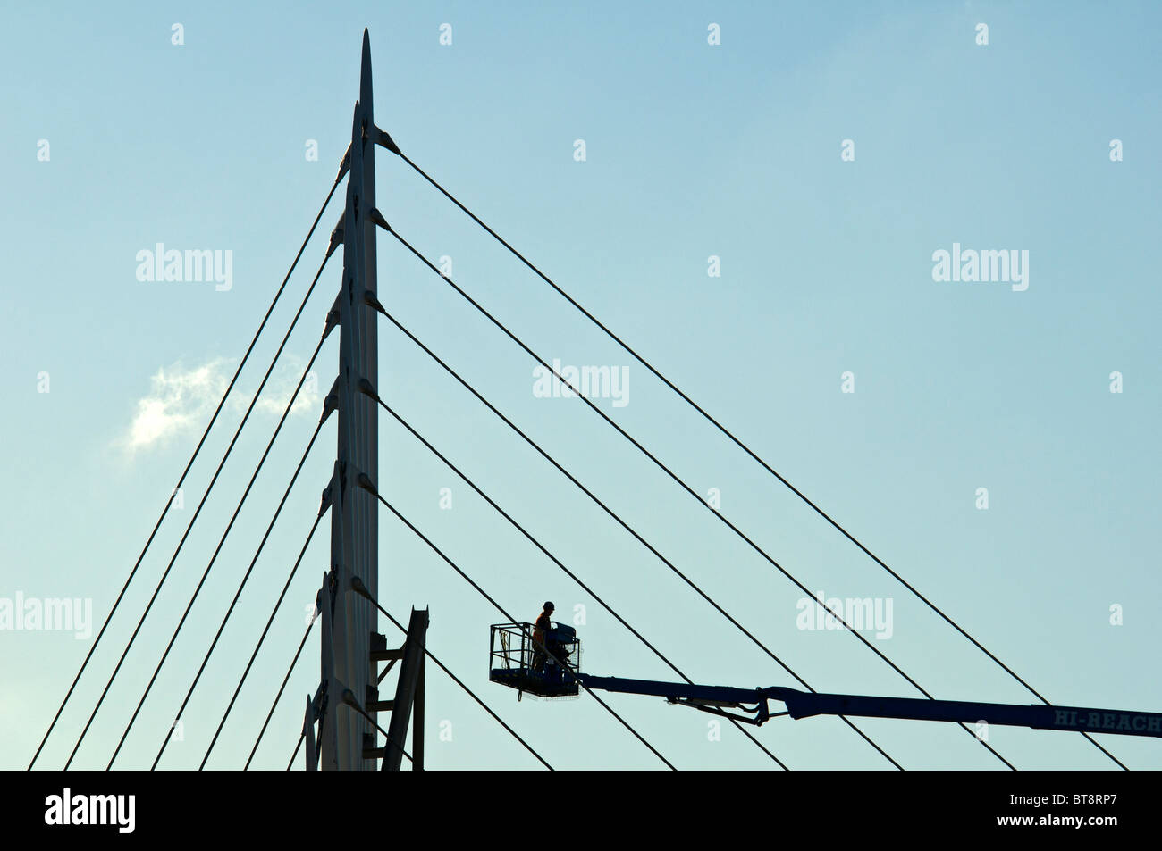 High reach access platform (cherry picker) working on a cable stayed ...